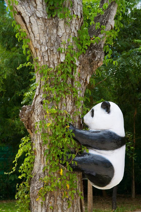 Fake panda stock image. Image of hold, panda, tree, sculpture - 33497467