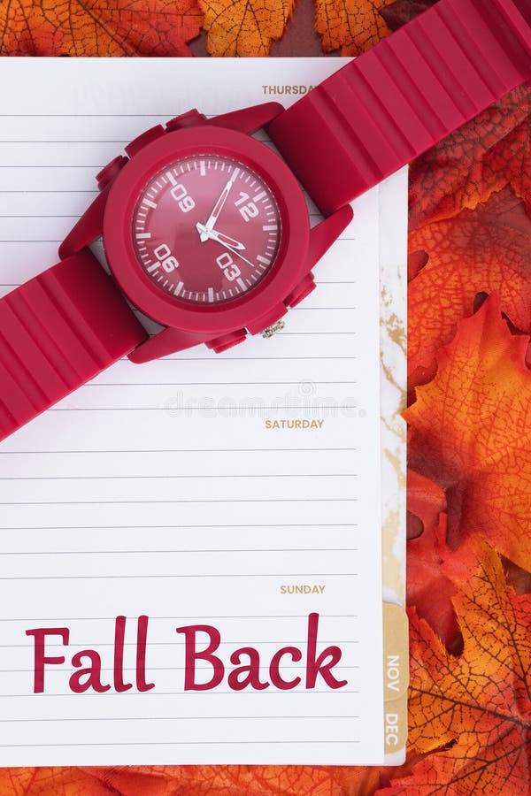 Fall Back on Day Planner and Watch with Fall Leaves Stock Photo - Image ...