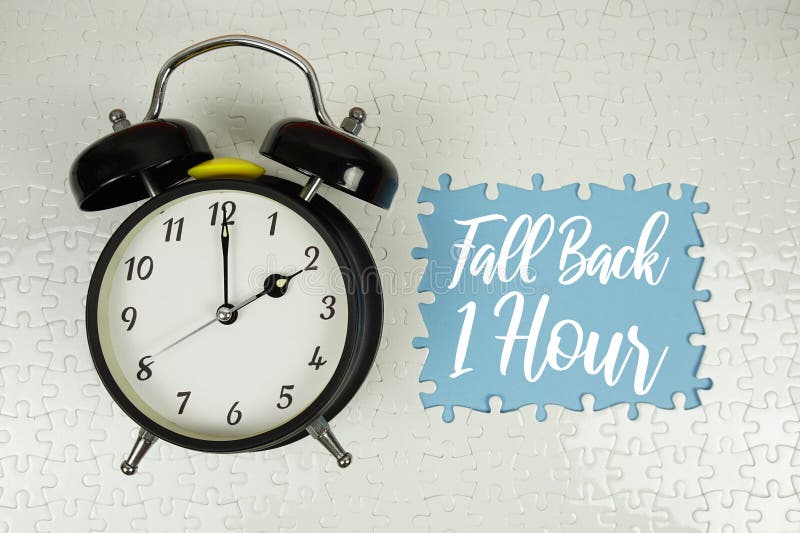 Fall Back 1 Hour Text with Alarm Clock on Blue Background Stock Photo ...