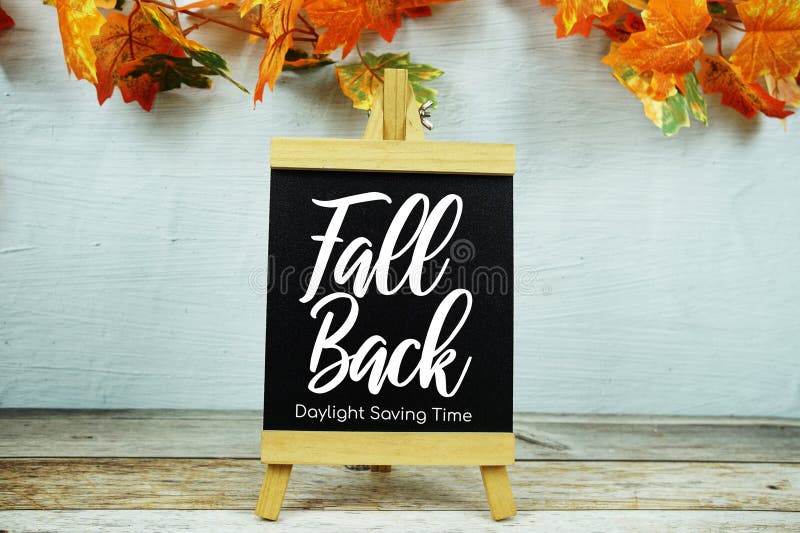 Fall Back Text Message with Maple Leaves on Wooden Background Stock ...