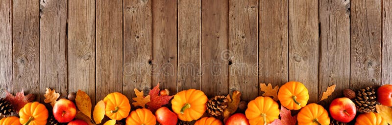 Fall Border with Pumpkins, Leaves and Apples on a Rustic Dark Wood ...