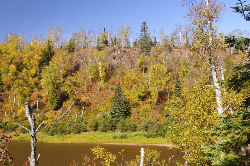 Fall Colors Along a Norht Woods River Stock Photo - Image of dramatic ...