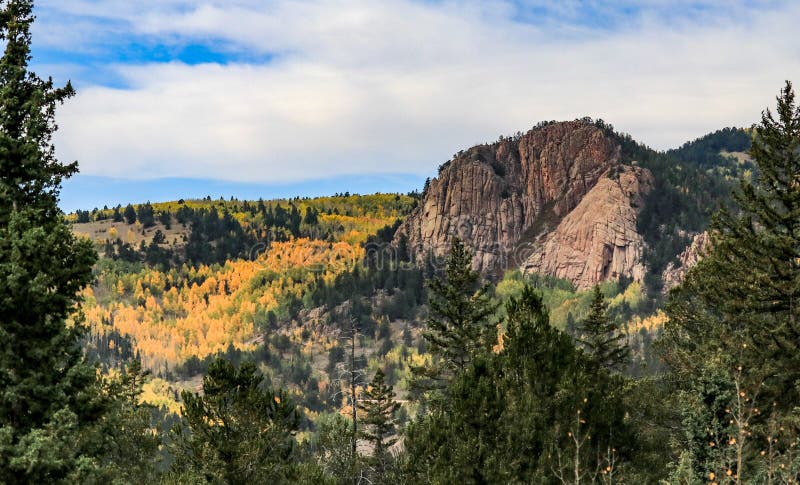 Fall Colors Around Mountain with Cloudy Sky Stock Photo - Image of fall ...