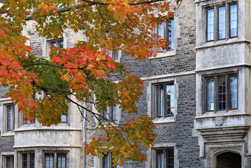 Fall Colors in Front of Gothic Style Stone College Building Stock Photo ...