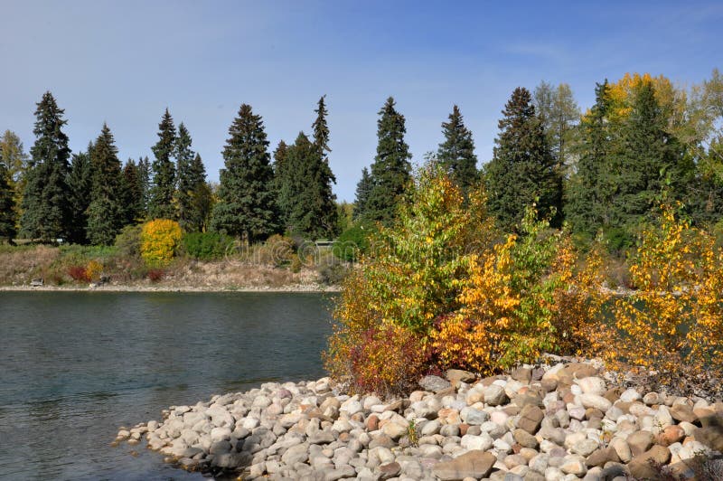 Fall Colors by the River stock image. Image of skies - 106700745