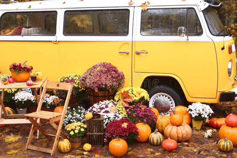 Fall Composition with Old Van, Pumpkin, Flowers and Yellow Leafs on the ...