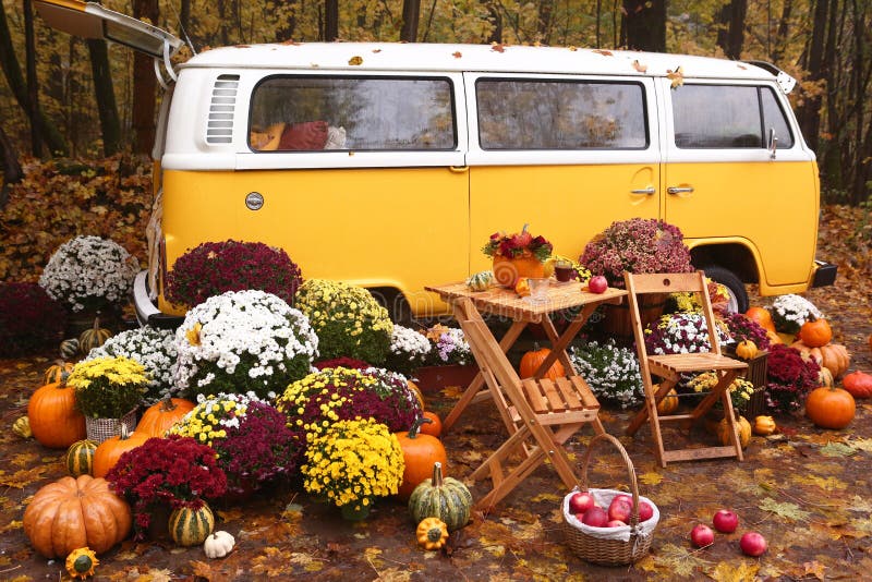 Fall Composition with Old Van, Pumpkins, Flowers and Picnic Chairs and ...
