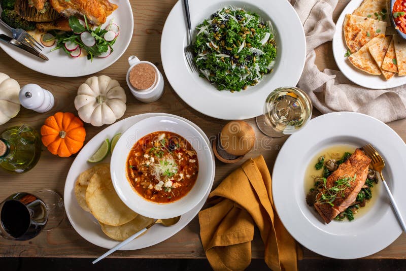 Fall Dinner Table Overhead Shot with Salad and Entrees Stock Photo ...