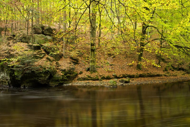 Fall Foliage Along River Banks Stock Photo - Image of rocks, spruce ...
