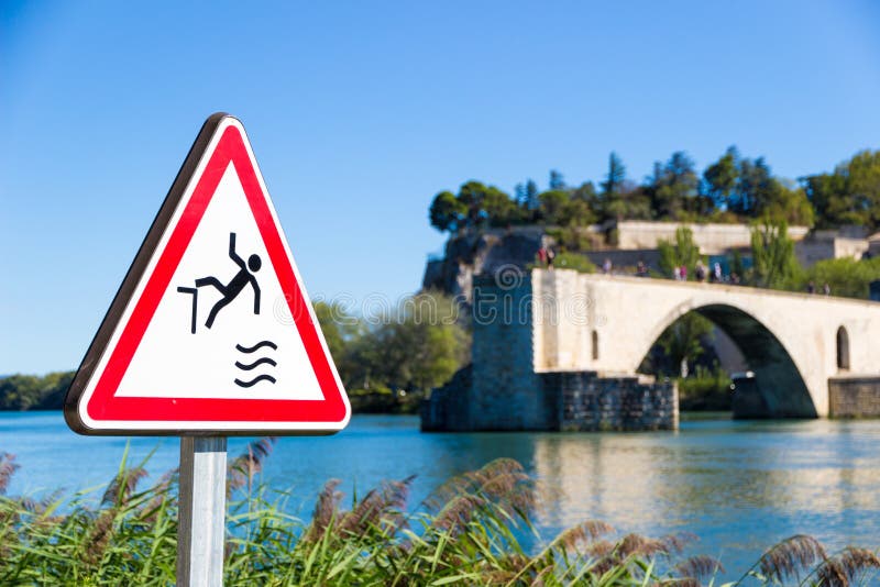 Fall Hazard Sign and Avignon Bridge in a Sunny Day Stock Image - Image ...