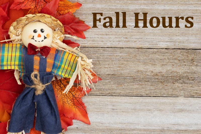 Fall Hours Message with Fall Leaves and Scarecrow on Weathered Wood ...