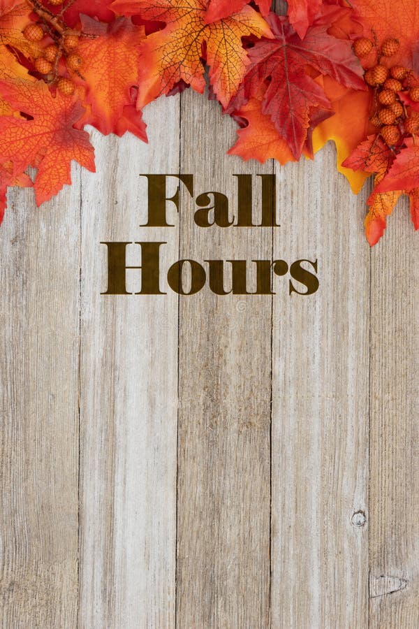 Fall Hours Message with Fall Leaves on Weathered Wood Stock Photo ...