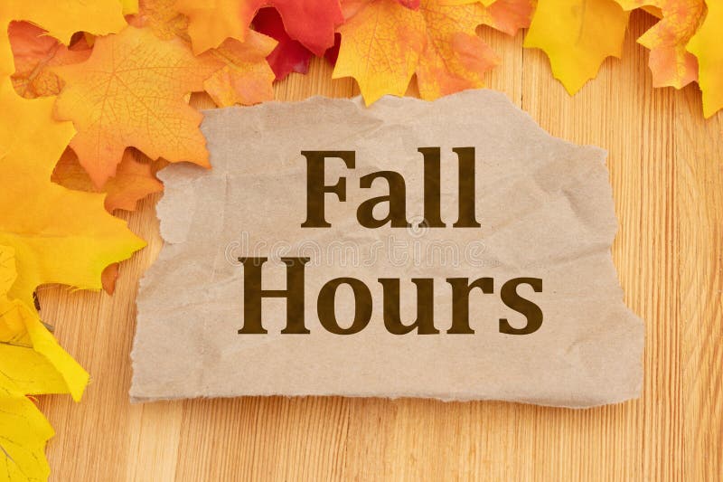 Fall Hours Note with Fall Leaves with a Torn Piece of Paper on Wood ...
