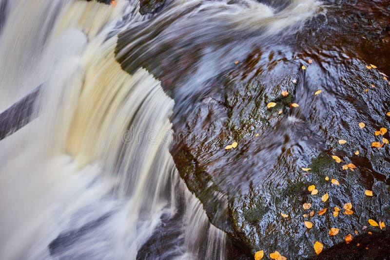 Fall Leaves on Rocks by Raging Waterfall Edge Up Close Stock Photo ...