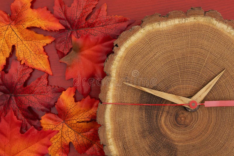 Fall Leaves and Wooden Clock on Wood for DST Stock Photo - Image of ...