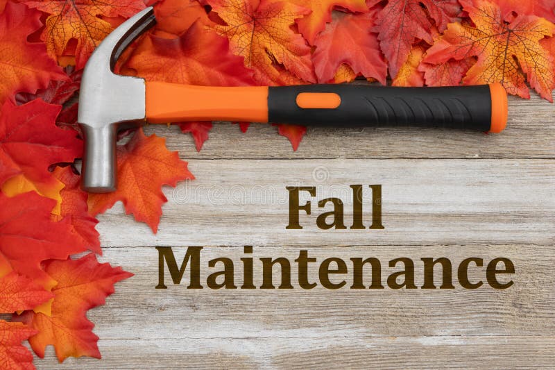 Fall Maintenance Message with a Hammer on Rustic Wood Stock Image ...