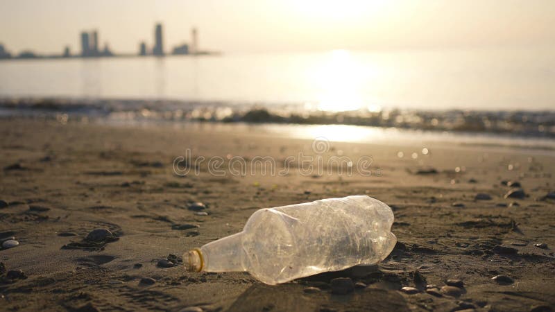 The Fall of a Plastic Bottle on the Beach, the Problem of Pollution of ...