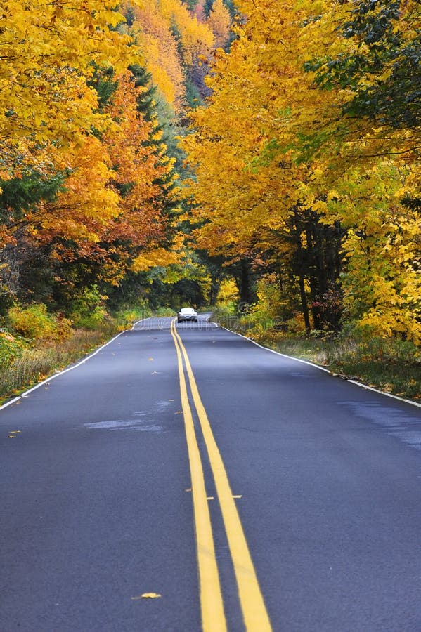 Fall Road with Car in Distance Stock Image - Image of touring, travel ...