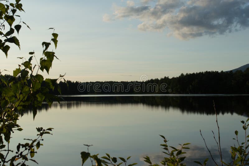 A Fall Sunset Turns a Lake into a Mirror Stock Photo - Image of loral ...