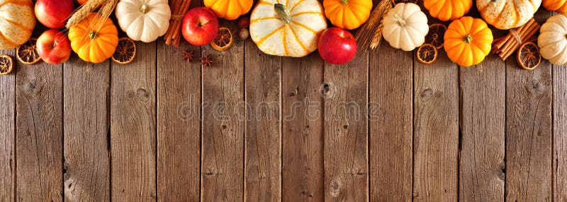 Pumpkins Apples and Corn on Rustic Harvest Table with Bokeh Lights ...