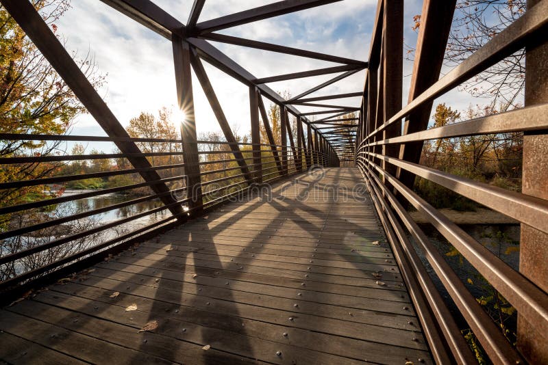 Fall Trees and Rusted Foot Bridge Cross a River Stock Photo - Image of ...
