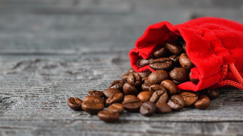 A Fallen Bag of Coffee Beans on a Dark Rustic Table. Stock Photo ...