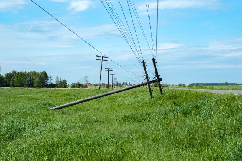 A Pole with Electrical Wires Fell by the Roadside Stock Photo - Image ...