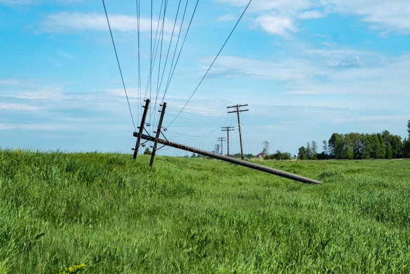 Fallen on the Field Pole with Electricity Stock Photo - Image of line ...
