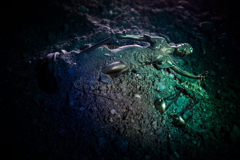 Fallen Lady Justice Statue with Scale in the Sand. Statue of Justice ...