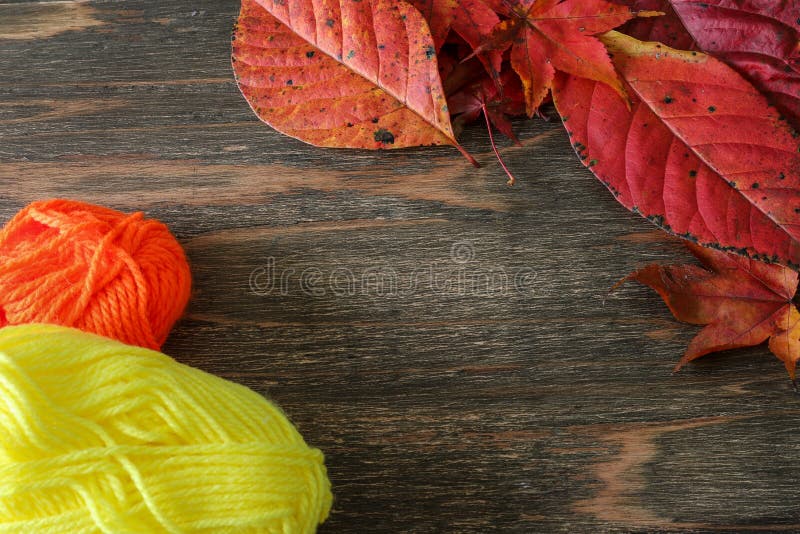 Fallen Leaves and Yarns in a Wooden Background Stock Photo - Image of ...