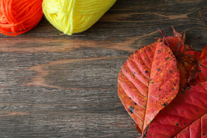 Fallen Leaves and Yarns in a Wooden Background Stock Image - Image of ...