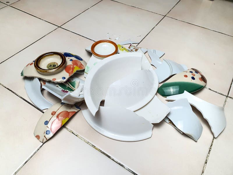 Fallen Pieces of Plates and Bowls on the Floor. Stock Photo - Image of ...