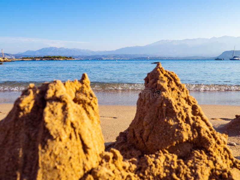 Fallen Sand Castles - Calm Sea and a Empty Beach Stock Photo - Image of ...
