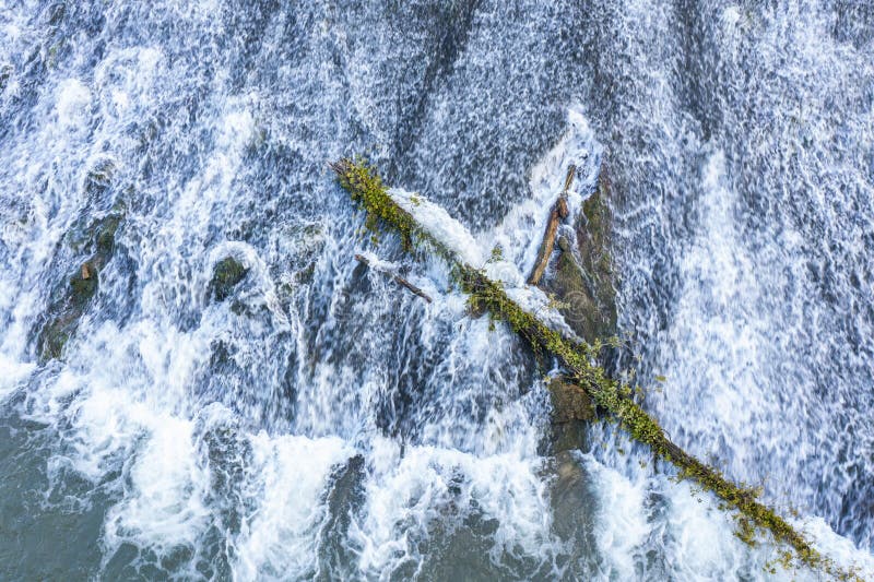 Fallen Tree Trunk Blocking Water Flow in River Rapids, Creating ...