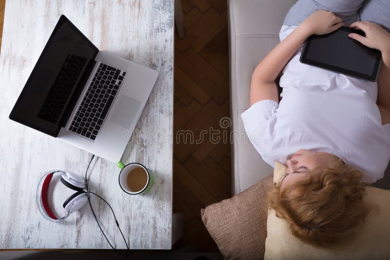 Falling Asleep on the Sofa at Night Stock Photo - Image of chubby ...
