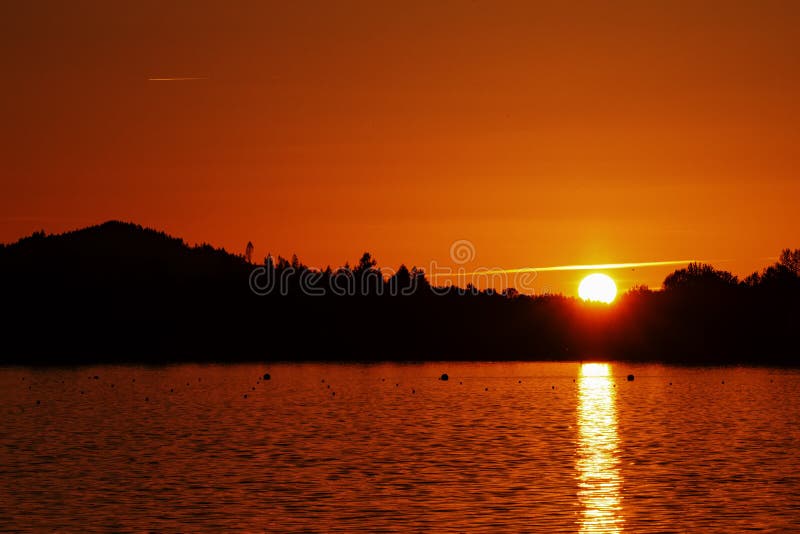 Falling Behind the Black Trees Stock Image - Image of sets, lake: 106614883