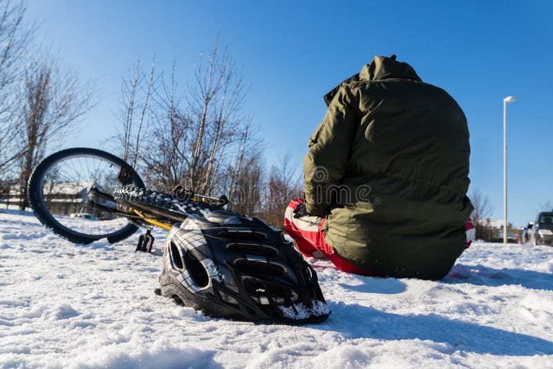Falling by bike in winter stock photo. Image of snow - 193699610