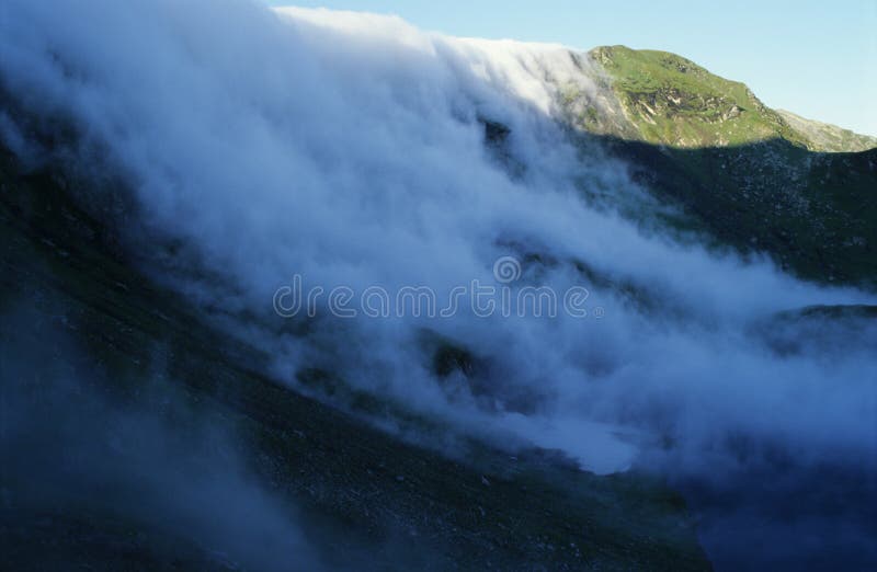 Falling clouds stock image. Image of clouds, blue, stone - 2379911