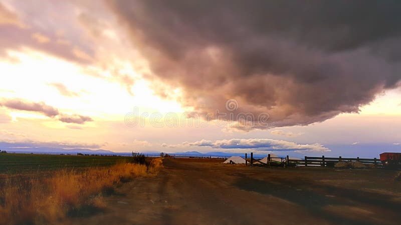 Falling clouds stock photo. Image of clouds, farm, sunset - 66257078