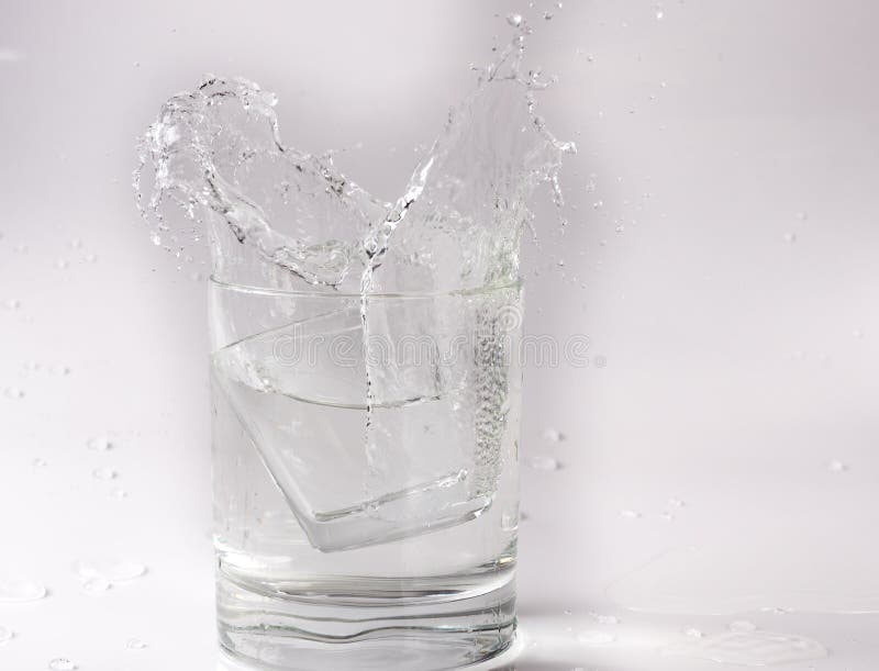 Falling and Crashing Glass of Water. Shards of Glass and Splashing ...