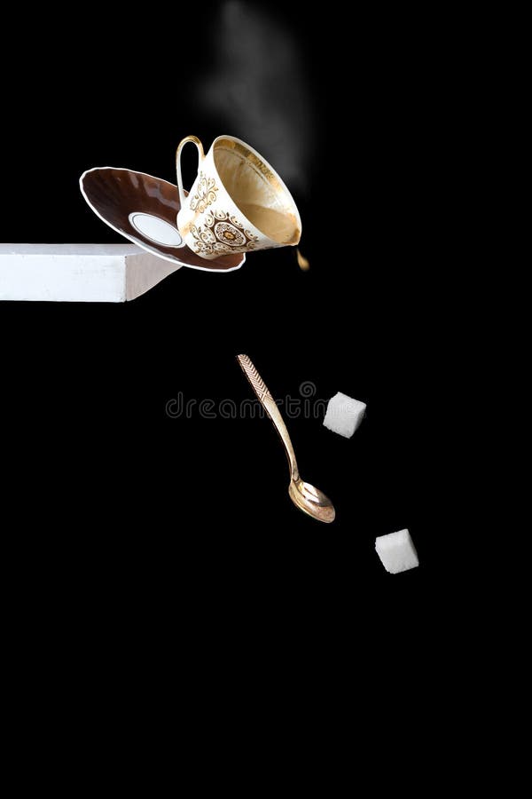 Falling of a cup of coffee stock photo. Image of saucer - 14396938