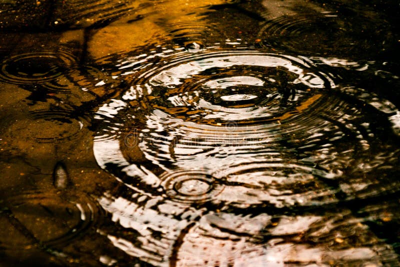 Falling Drop of Water in a Puddle Stock Image - Image of droplet ...