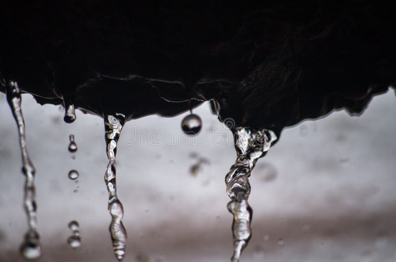 Falling water on a rock stock photo. Image of shape - 169374808