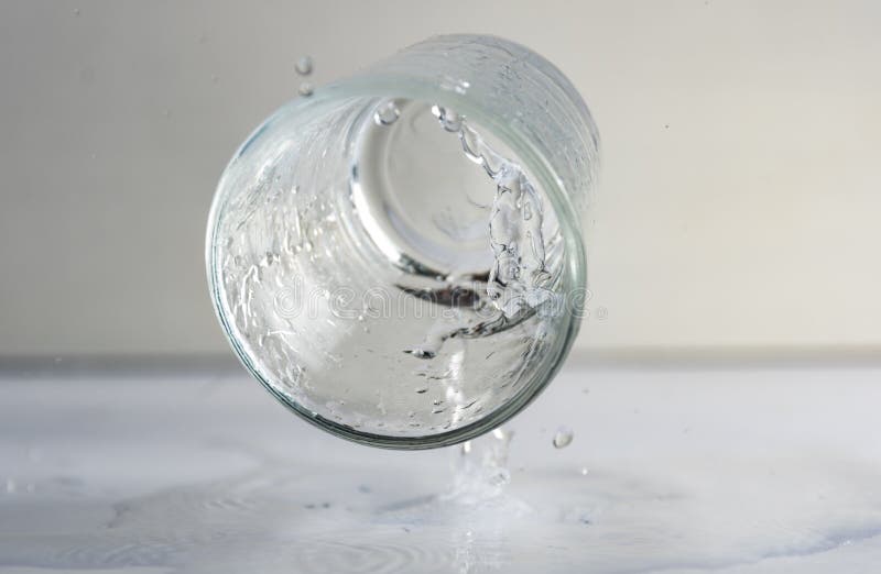 Falling, Flying or Standing Glass with a Clear Liquid Intended for ...