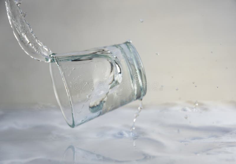 Falling, Flying or Standing Glass with a Clear Liquid Intended for ...