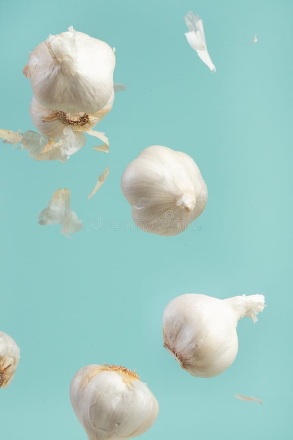 Falling Garlic, on a Light Background. Isolate for Design, Freeze in ...