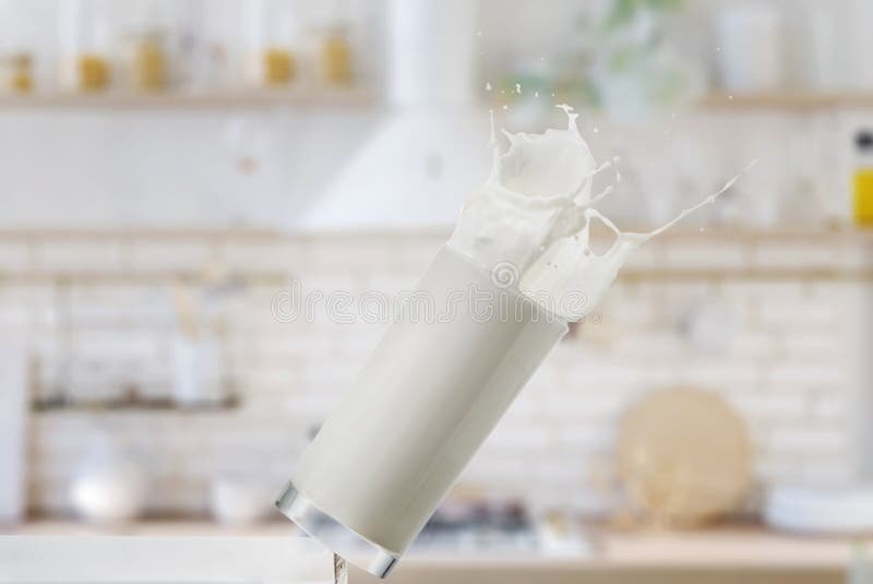 Falling Glass with Milk in the Kitchen Stock Photo - Image of liquid ...