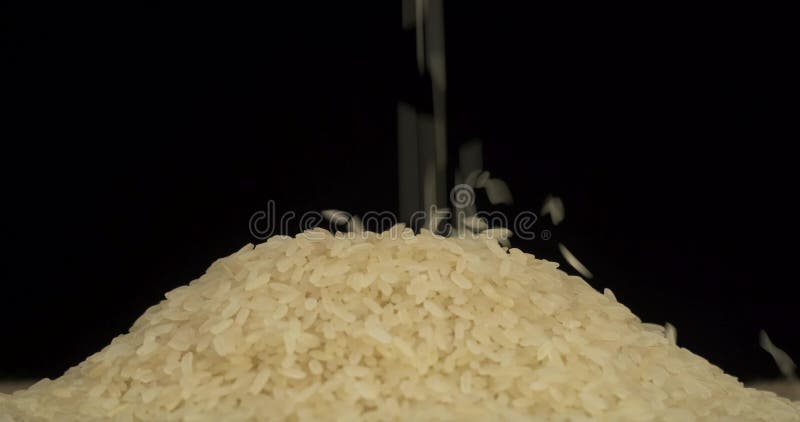 Falling Grain Onto a Heap of Rice Seeds. Rotating Pile of Grain Stock ...