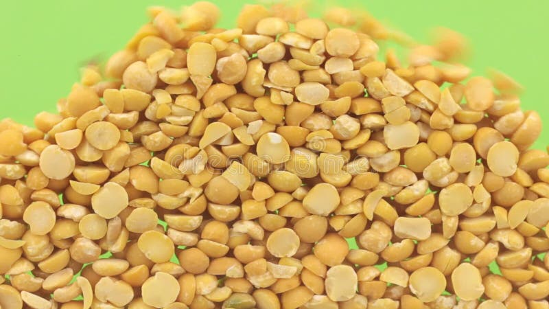 Falling Grains of Pea on a Pile of Pea on a Green Screen. Stock Video ...