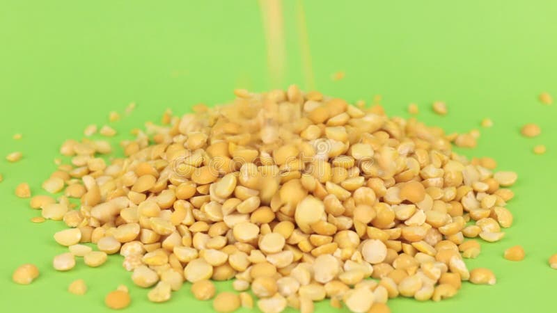 Falling Grains of Pea on a Pile of Pea on a Green Screen. Stock Footage ...